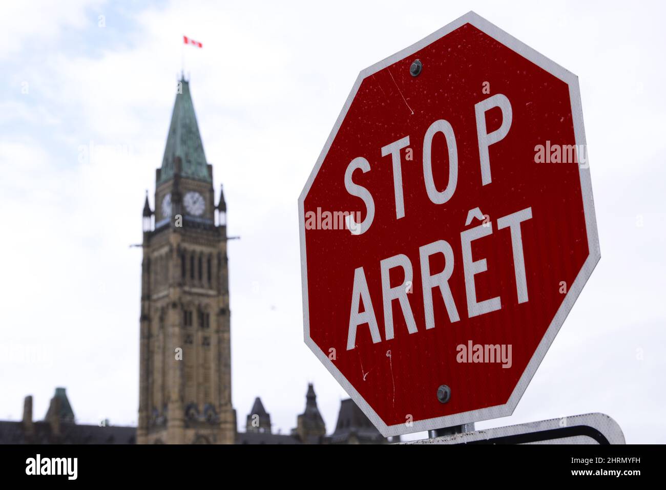 A stop sign is shown by Parliament Hill in Ottawa on Friday, March 13 ...