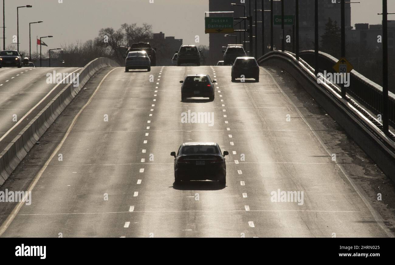 Light rush hour traffic crosses an inter-provincial bridge between ...