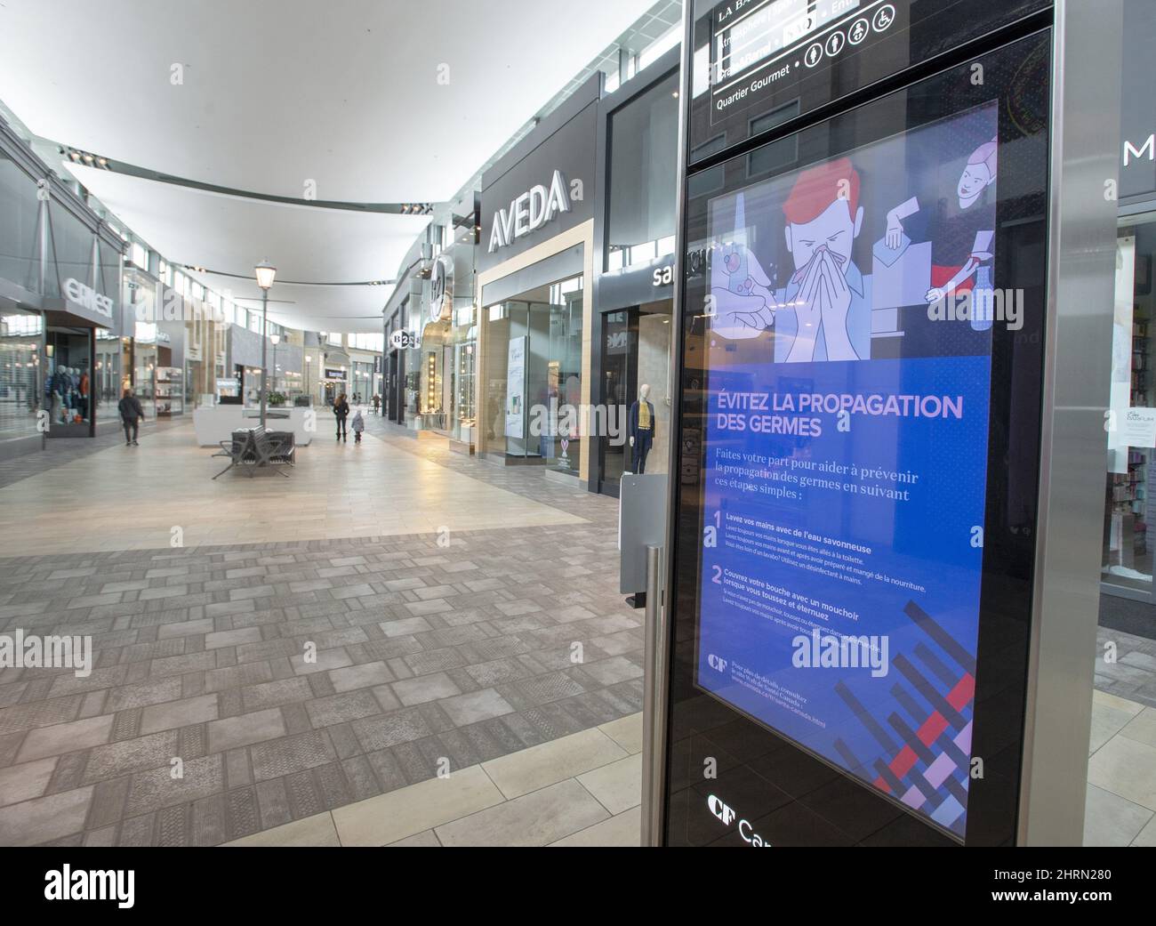 A sign showing people how to avoid spreading germs is seen in a nearly ...