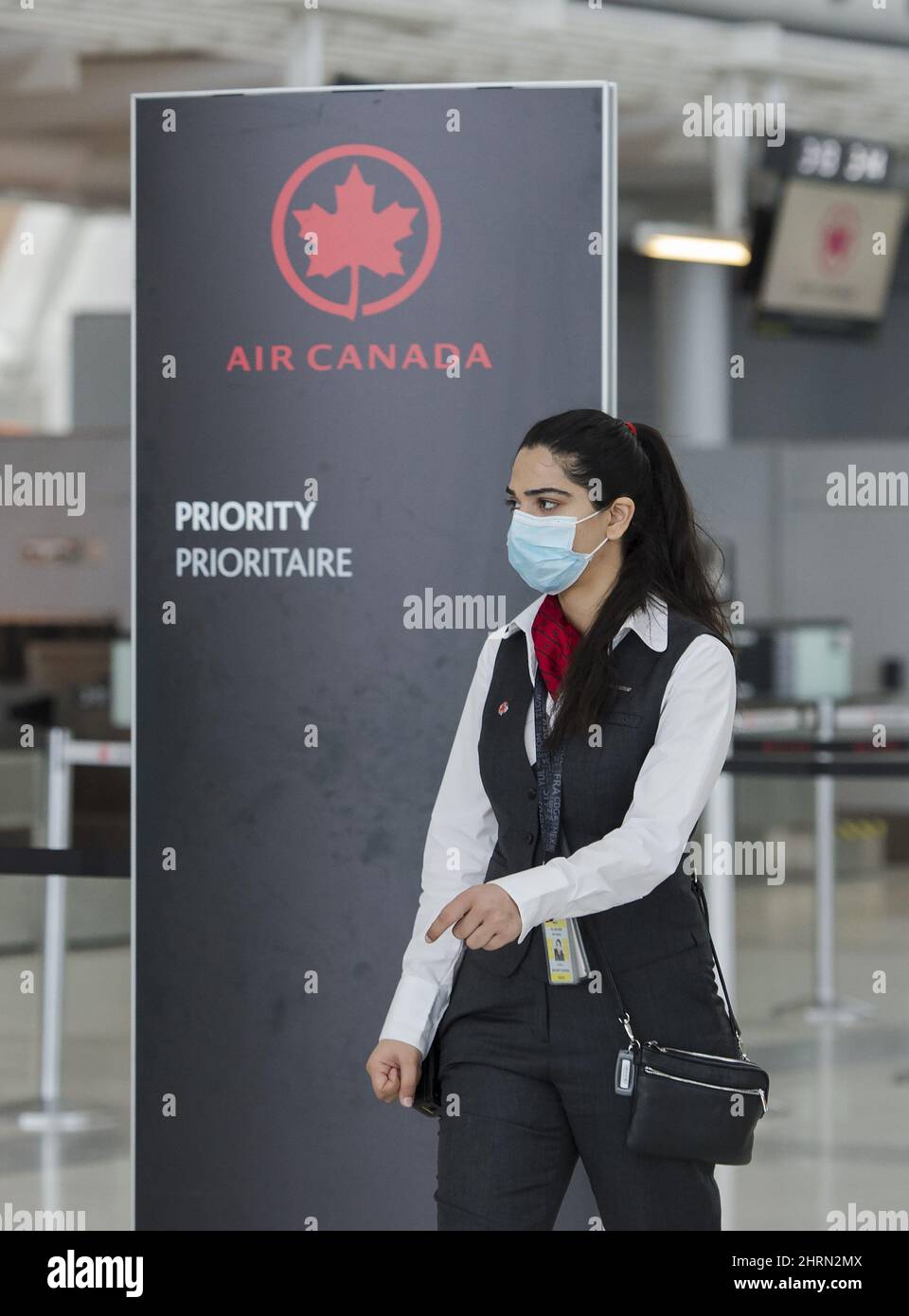 An Air Canada employee works at Pearson International Airport in ...