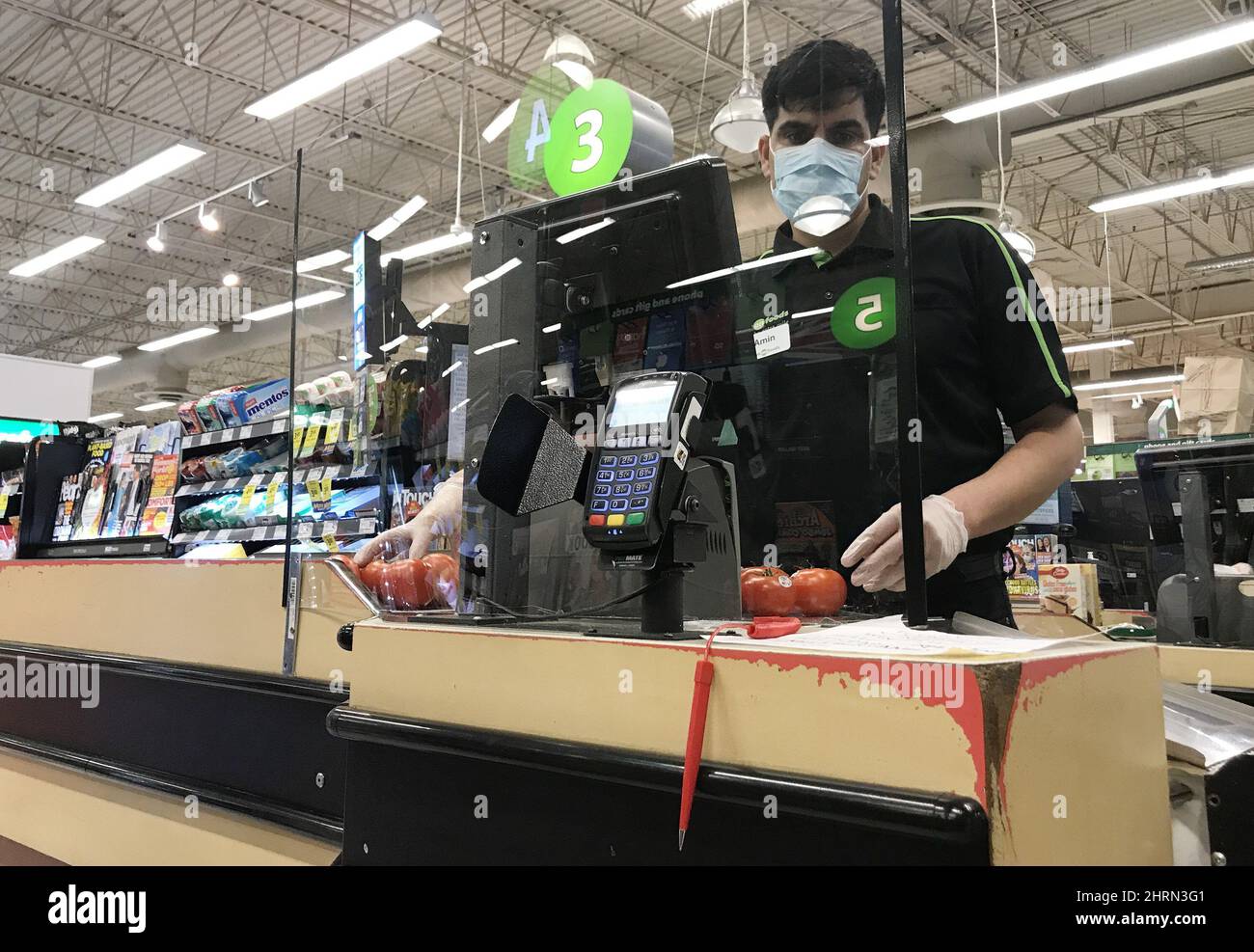 A plexiglass barrier is pictured creating a barrier to protect a ...