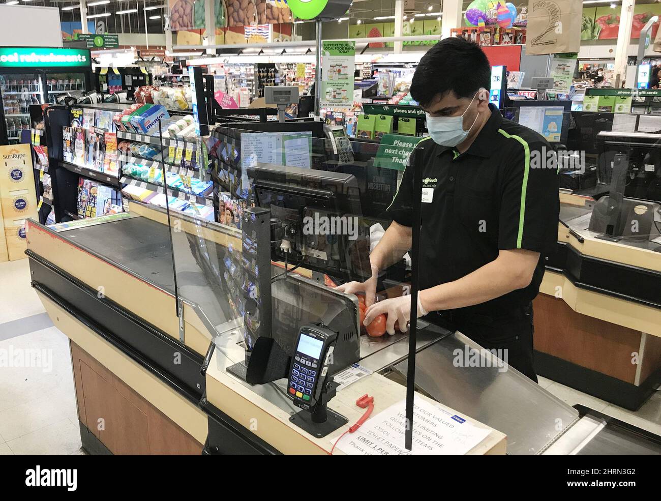 A plexiglass barrier is pictured creating a barrier to protect a ...