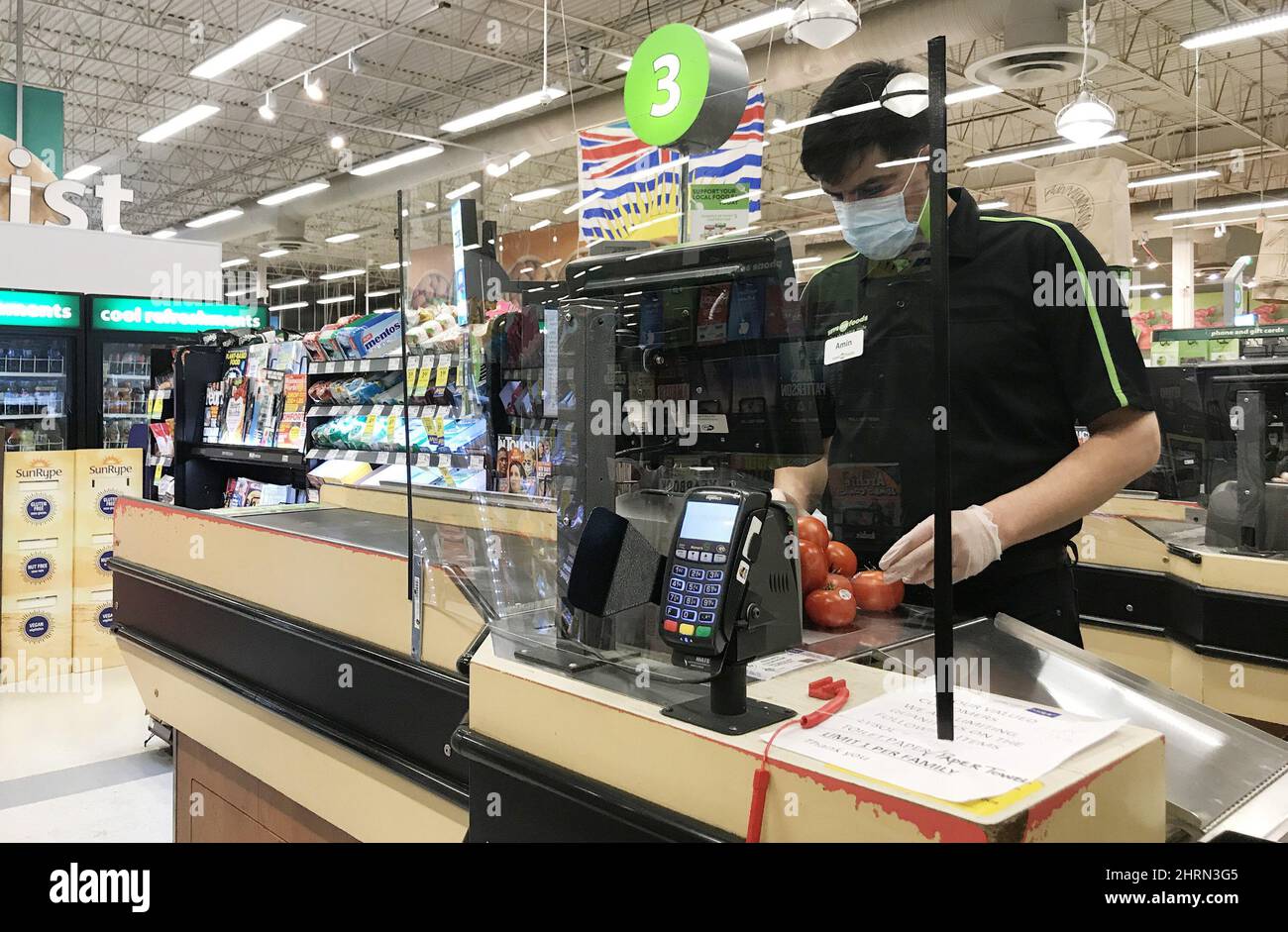 A plexiglass barrier is pictured creating a barrier to protect a ...