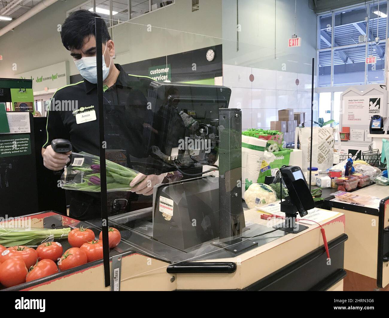 A plexiglass barrier is pictured creating a barrier to protect a ...