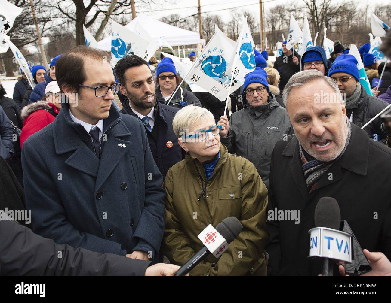 Sylvie Nelson, centre, president of the SQEES-FTQ union, looks on as ...