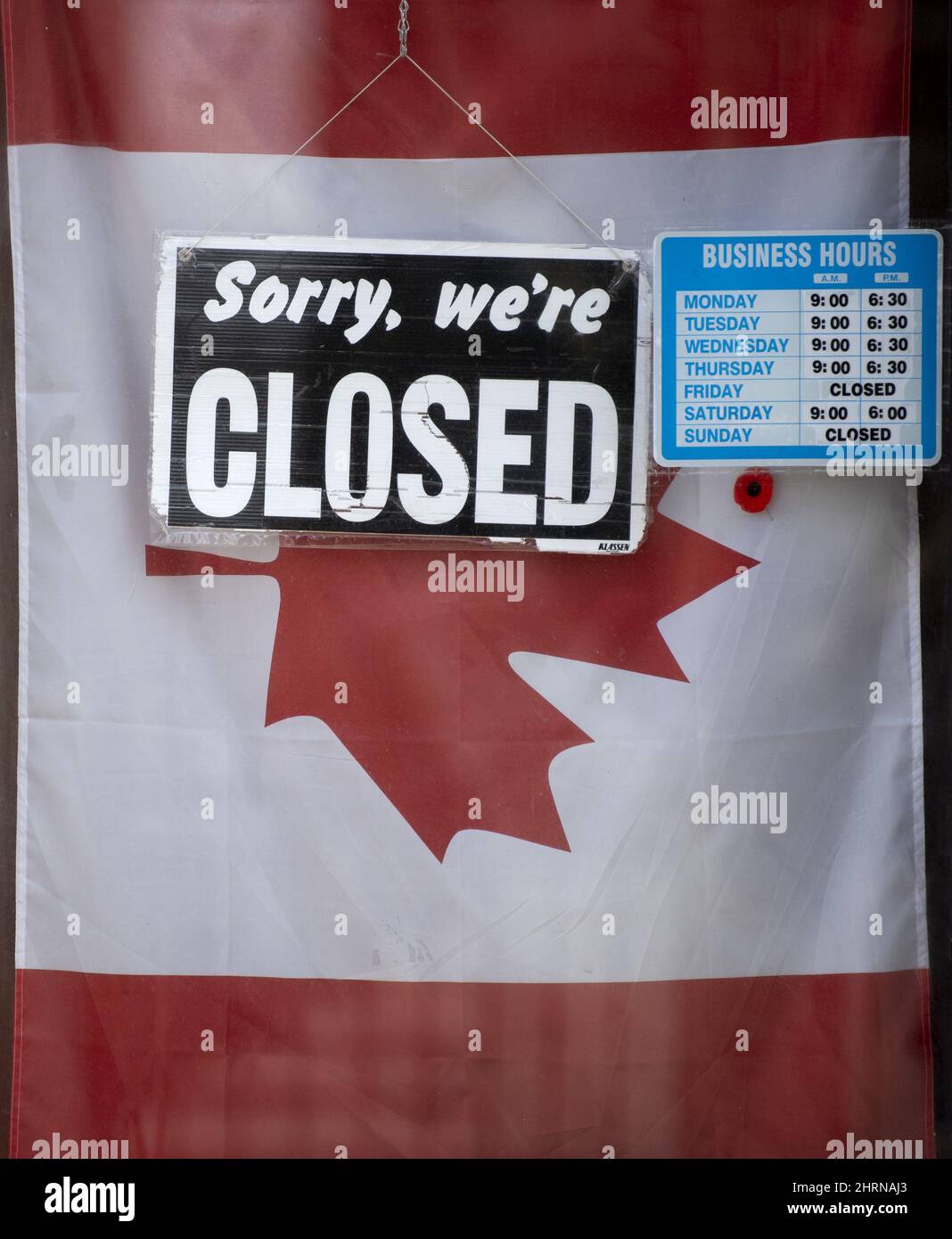 A 'Closed' sign hangs in a store window in Ottawa, Thursday April 16 ...