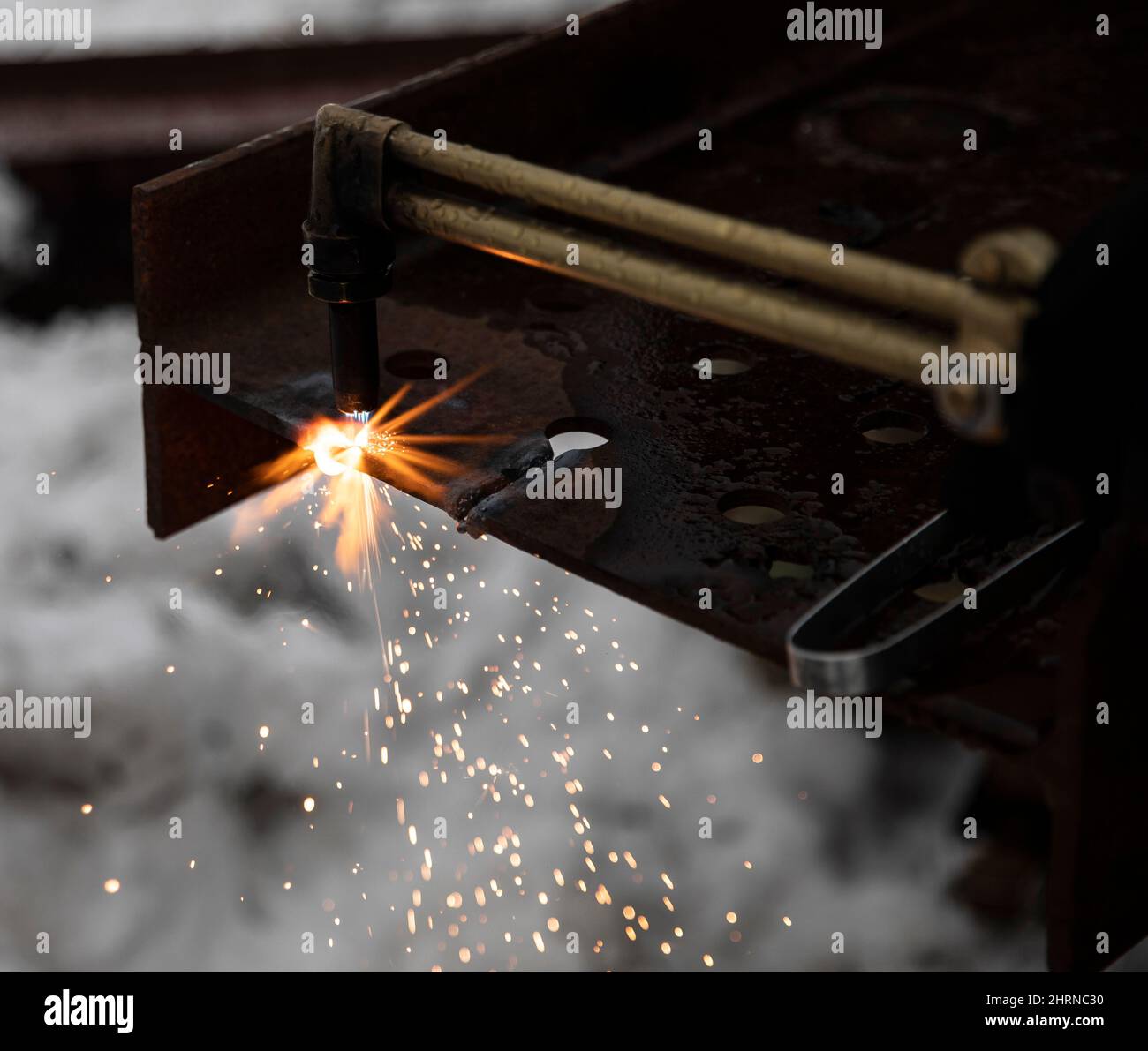 A Firefighter with the Anchorage Fire Department utilizes a metal ...