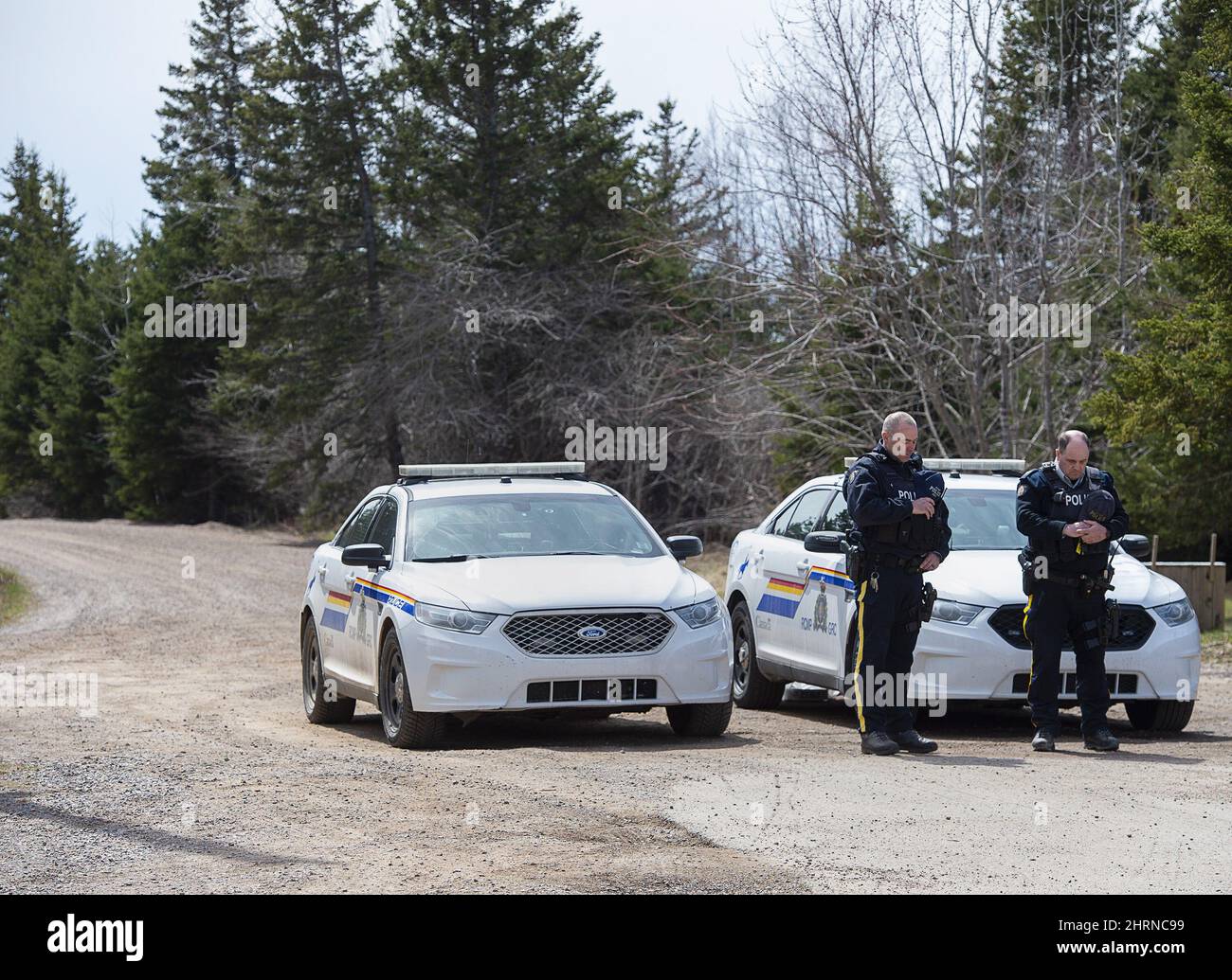 Two RCMP officers observe a moment of silence to honour slain Const ...
