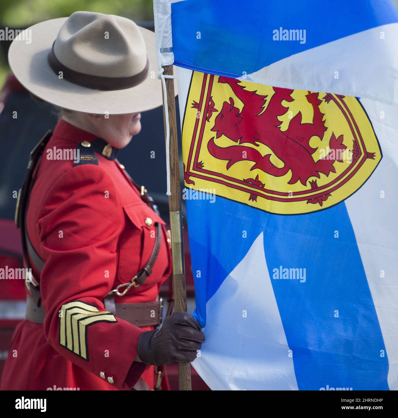 RCMP Staff Sgt. Kerry Blades holds the Nova Scotia flag following a ...