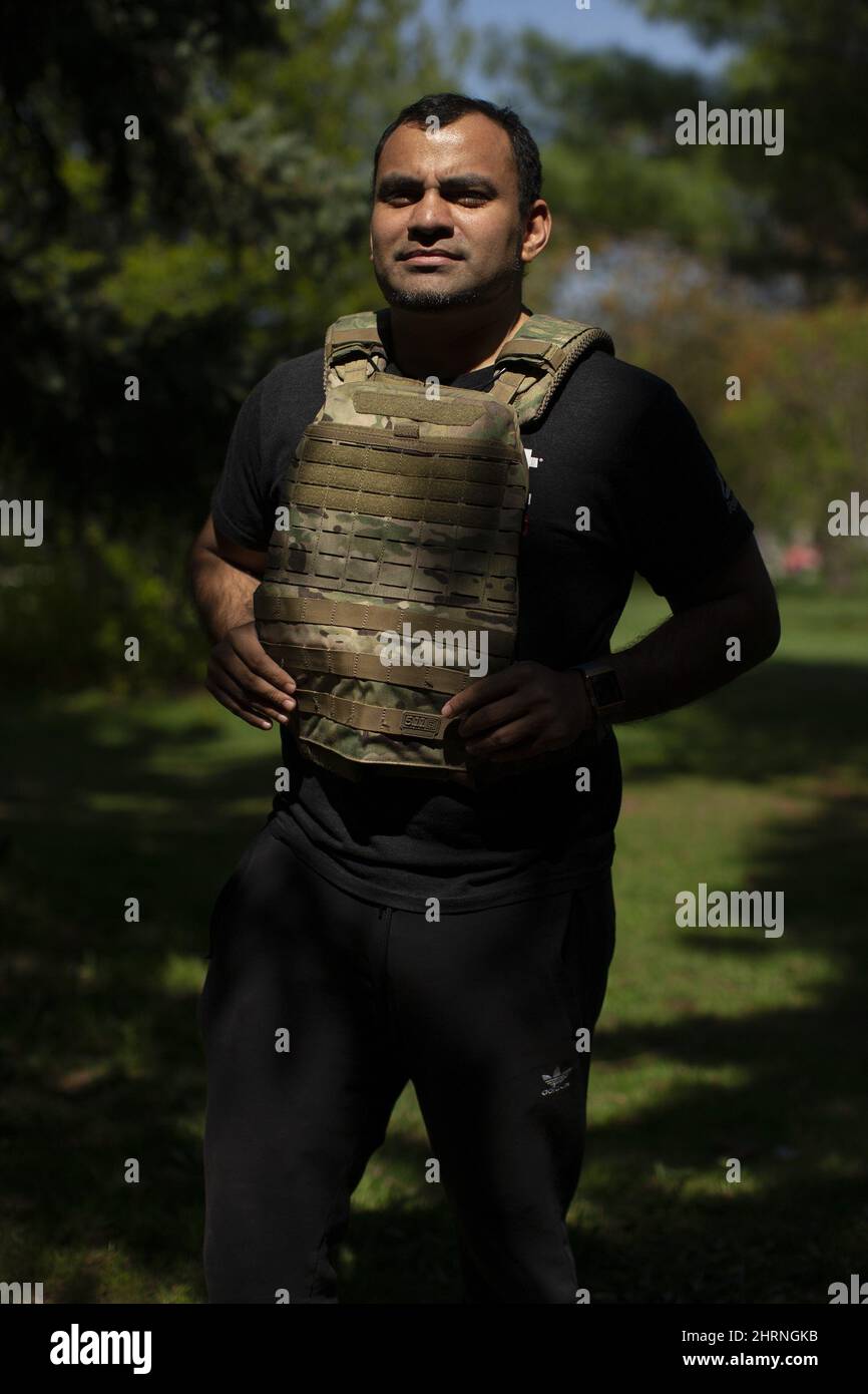 Crossfit enthusiast David Rios is pictured wearing his weighted vest ...