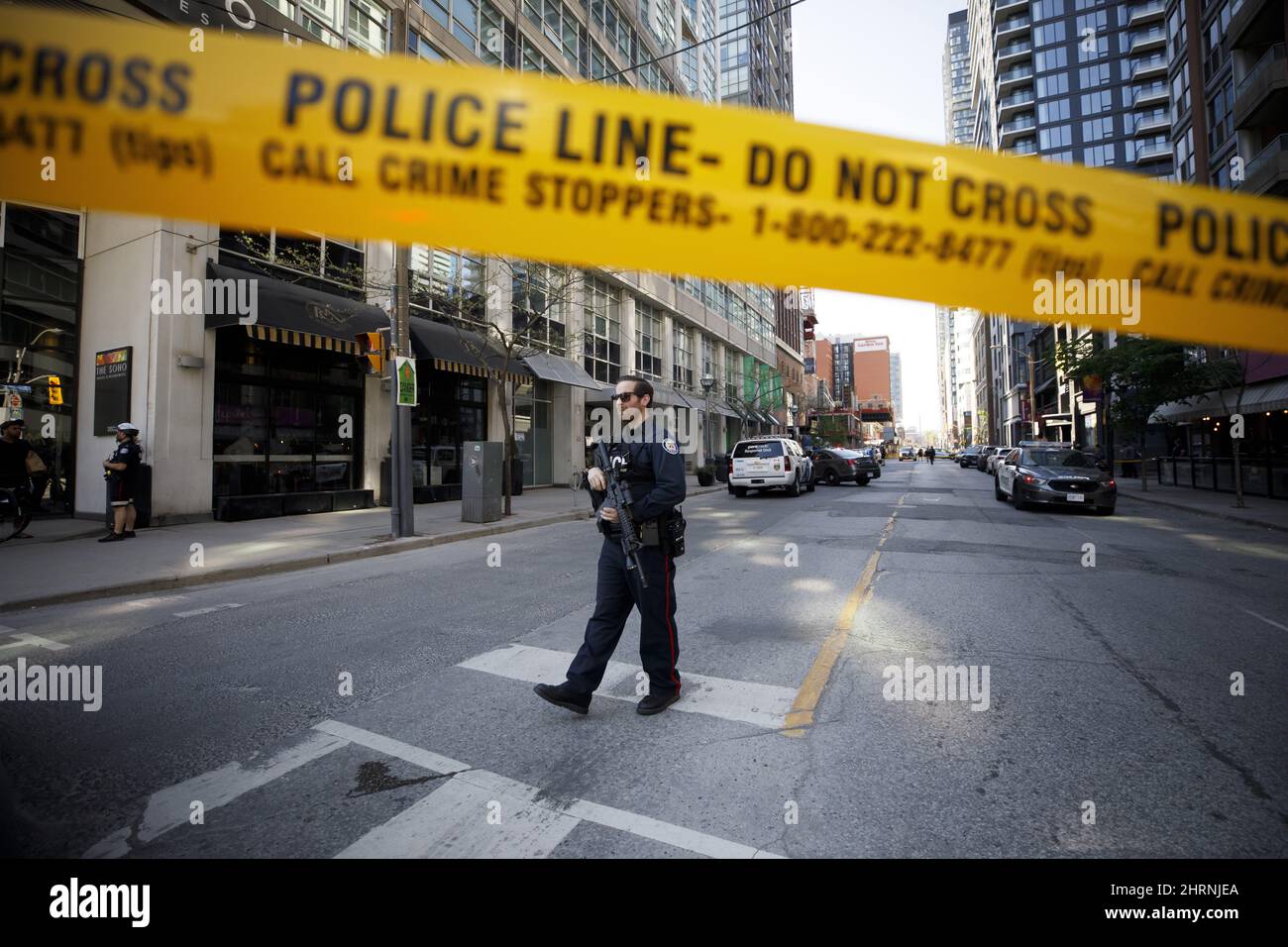 Toronto Police work the scene of a shooting where two people were sent ...