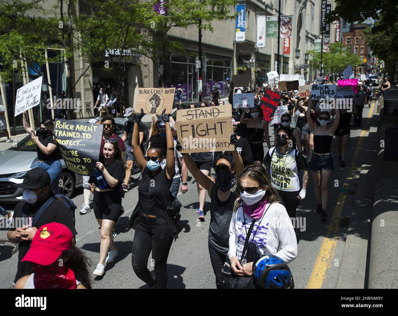 Thousands of people protest at an anti-racism demonstration reflecting ...