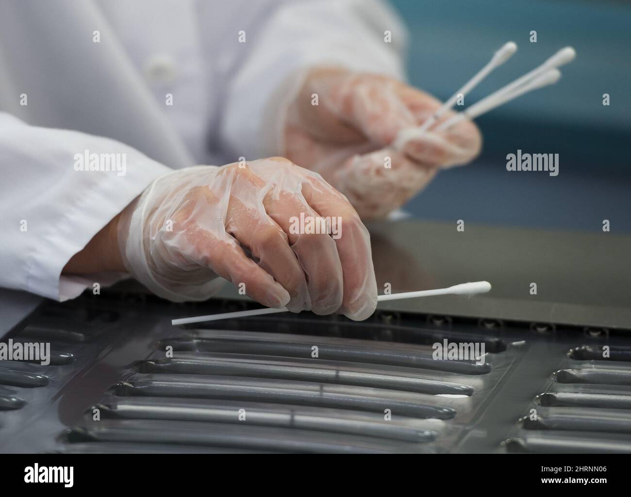 Employees work at the Canadian Hospital Specialities (CHS) helping take ...