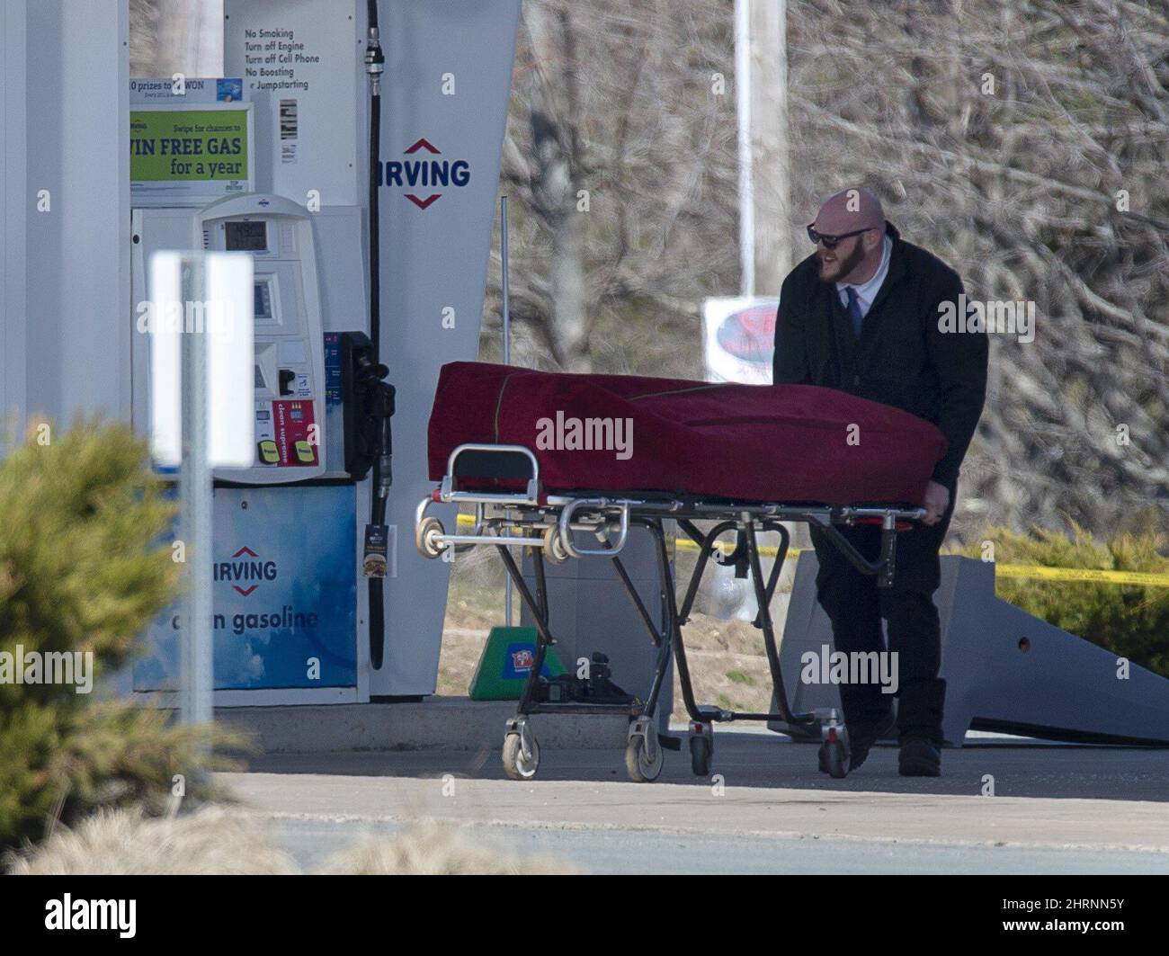 A worker with the medical examiner's office removes the body of Gabriel ...