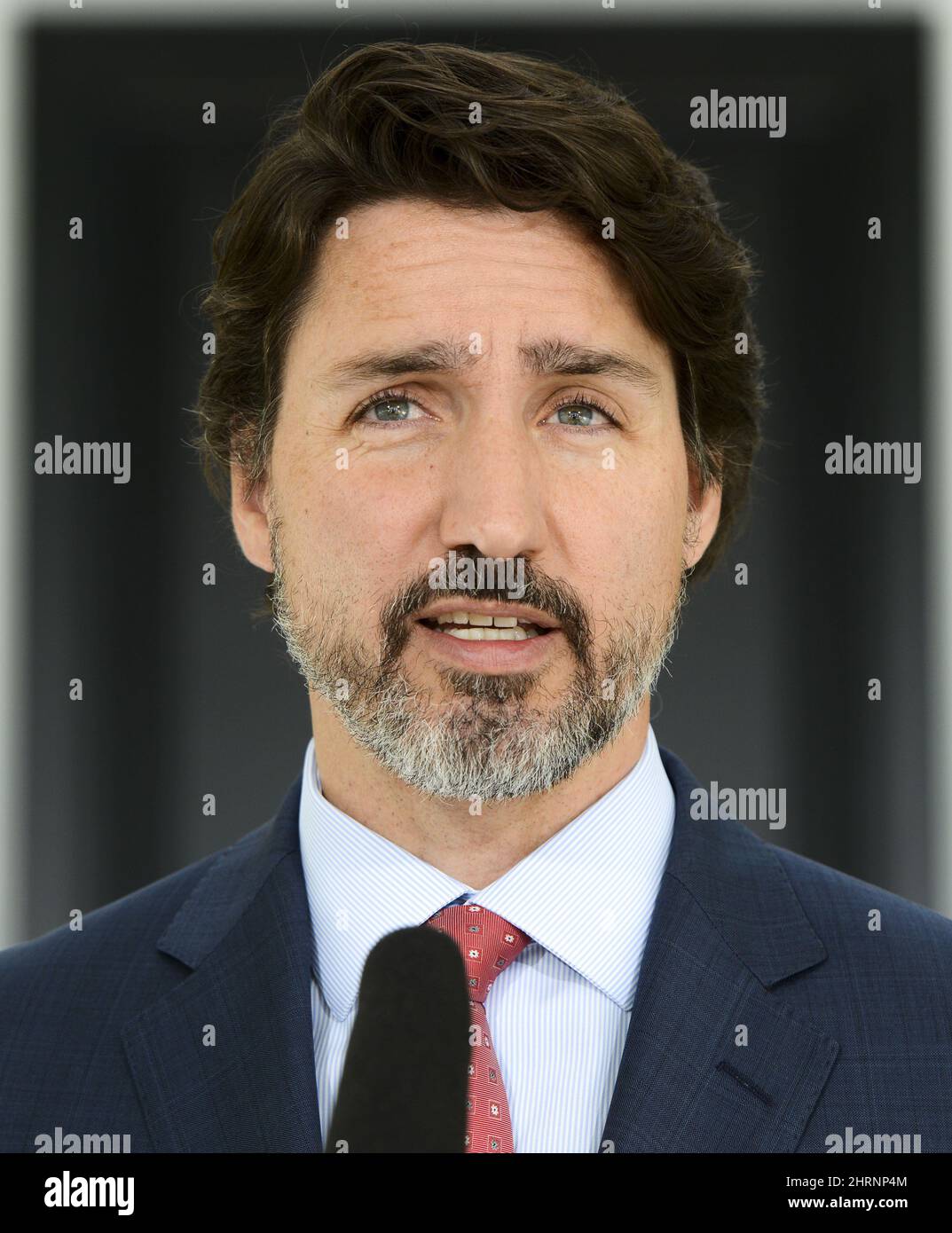 Prime Minister Justin Trudeau sports a fresh haircut as he holds a ...