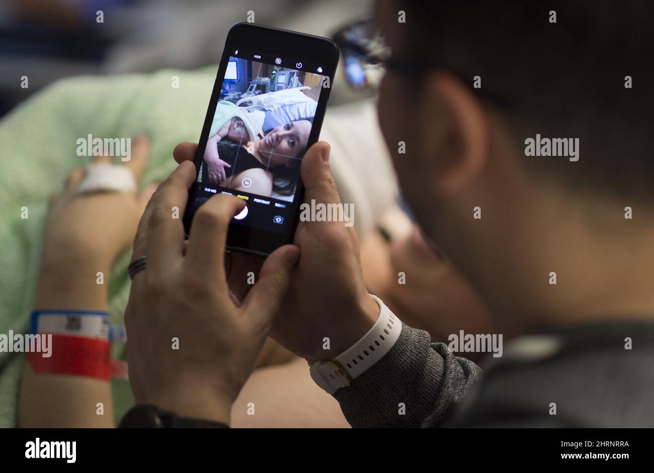 Brian Chong takes a photo of wife Kate and their new baby girl Adelynn ...