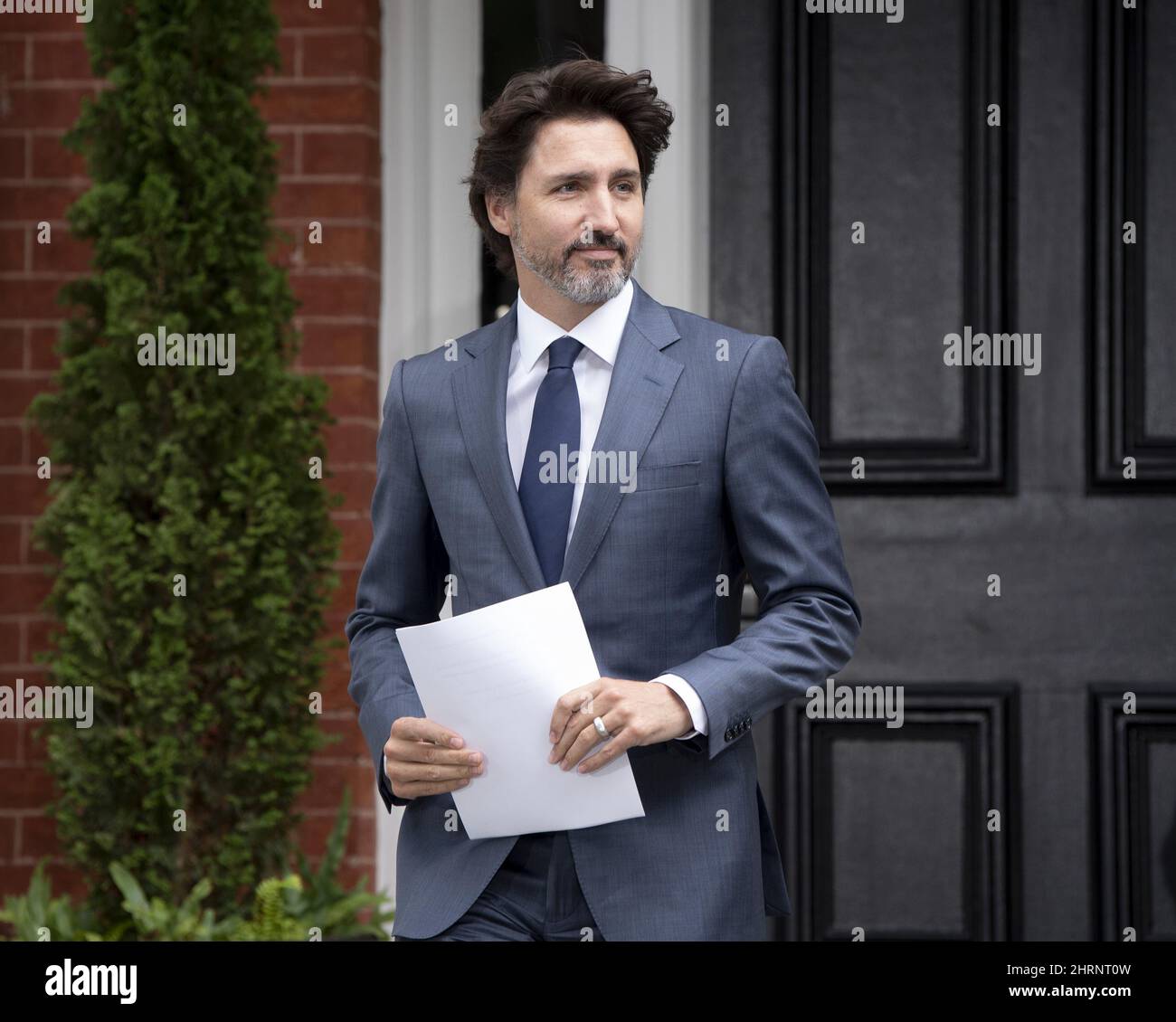 Prime Minister Justin Trudeau makes his way to the podium for a news ...