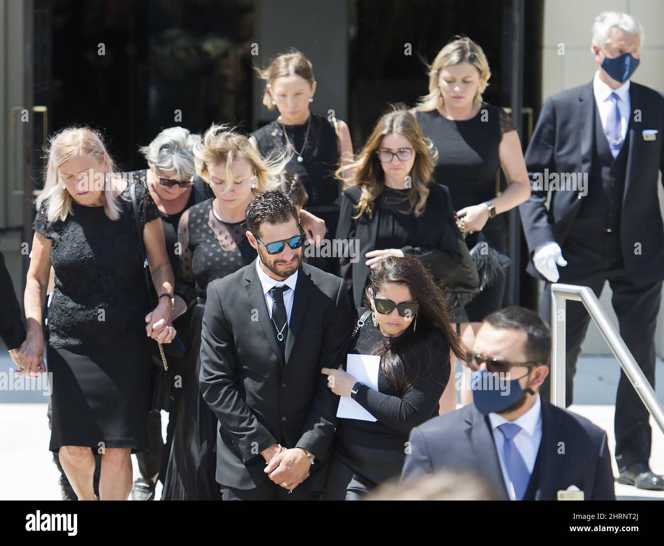 Father and husband Michael Ciasullo, centre, watches as pallbearers ...
