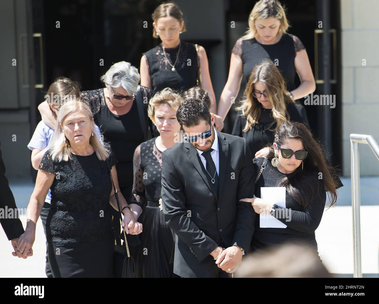 Father and husband Michael Ciasullo, centre, watches as pallbearers ...