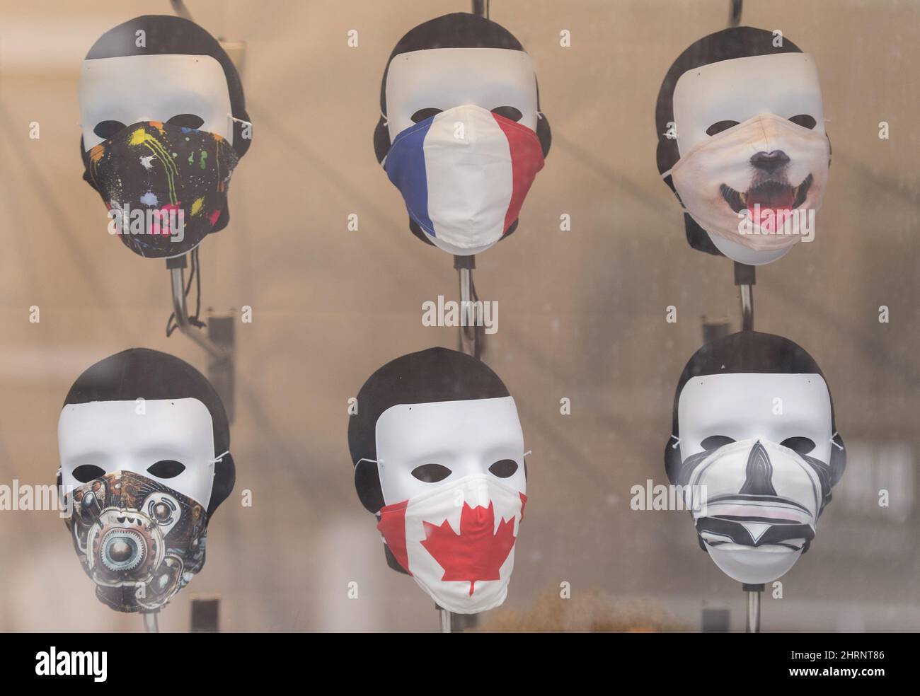 Face masks are shown in the window of a store in Montreal, Saturday ...