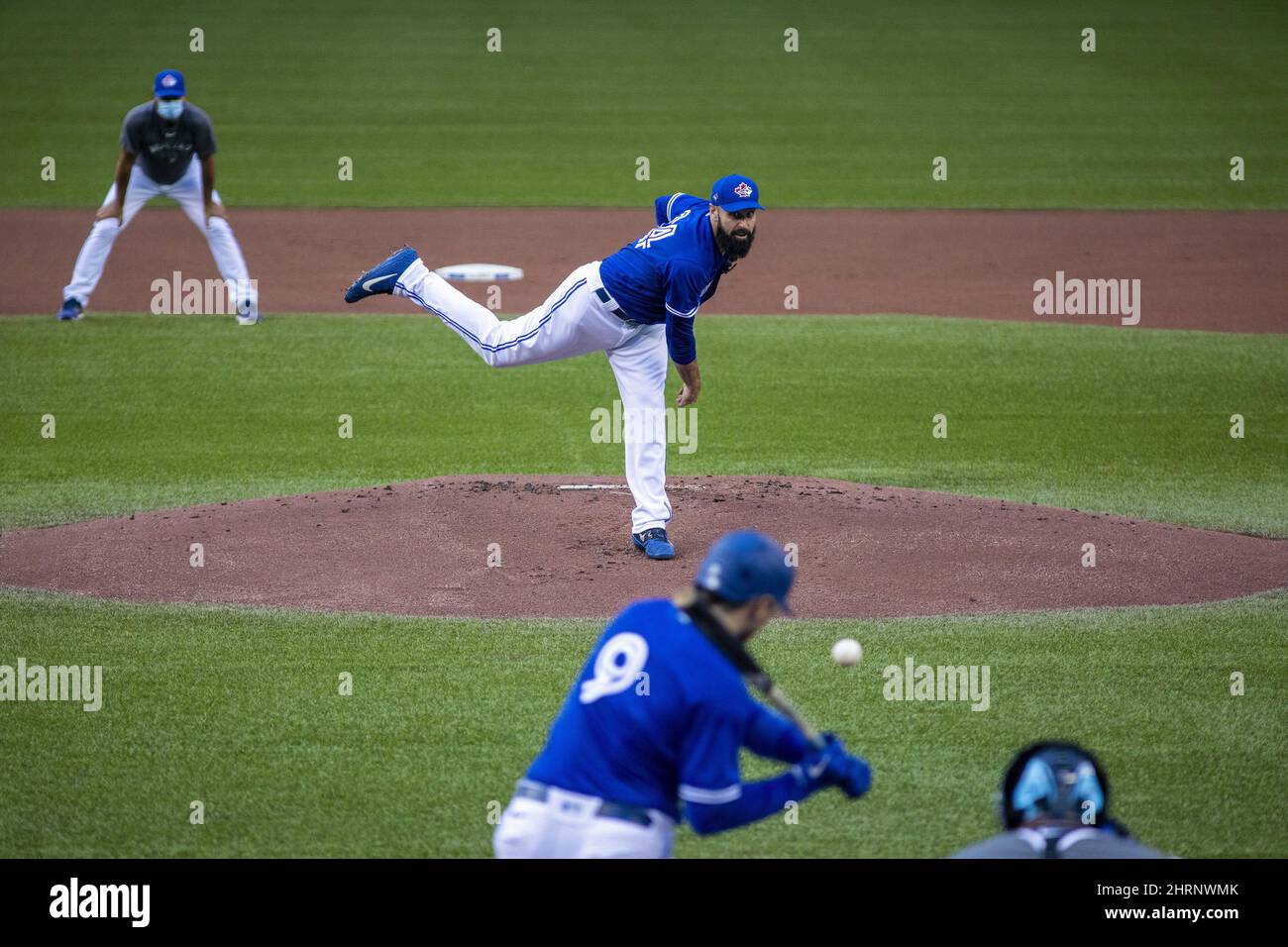Toronto Blue Jays pitcher Matt Shoemaker delivers a pitch to teammate ...