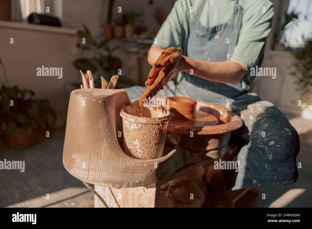 Woman working raw clay hi-res stock photography and images - Alamy