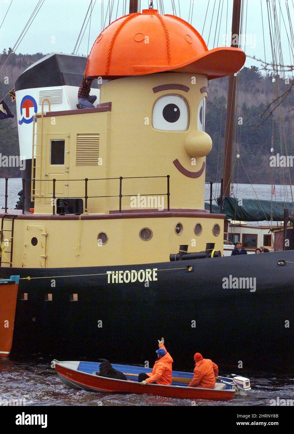 Boaters wave to Theodore Too, an ocean-going tugboat launched in ...