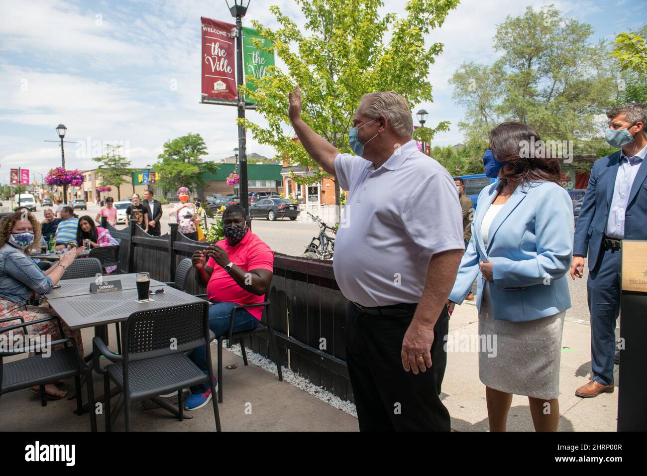 Ontario Premier Doug Ford waves to customers at Cuchulainn's Irish Pub ...