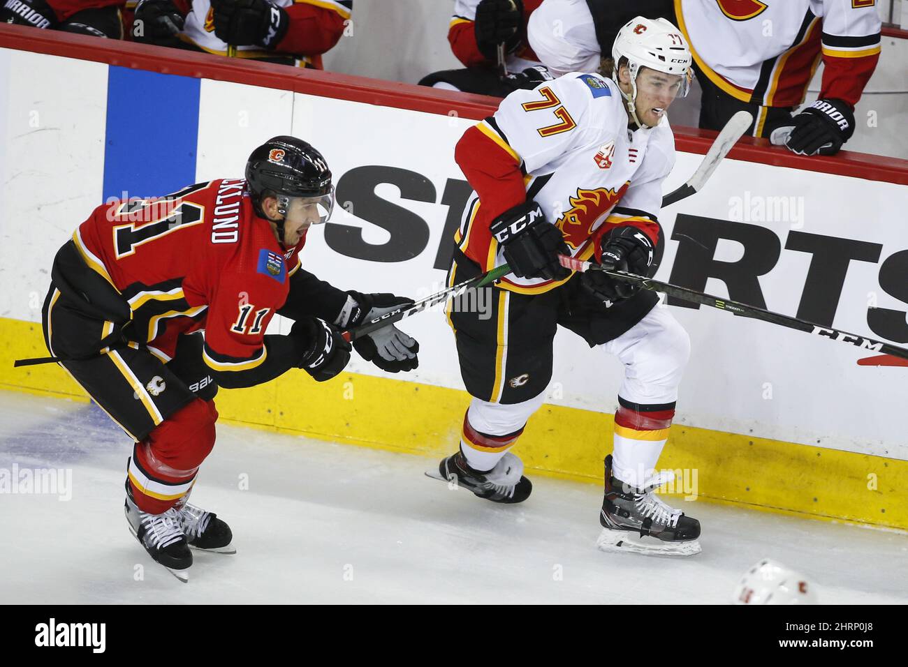 Calgary Flames' Mark Jankowski, right, gets past Mikael Backlund during ...