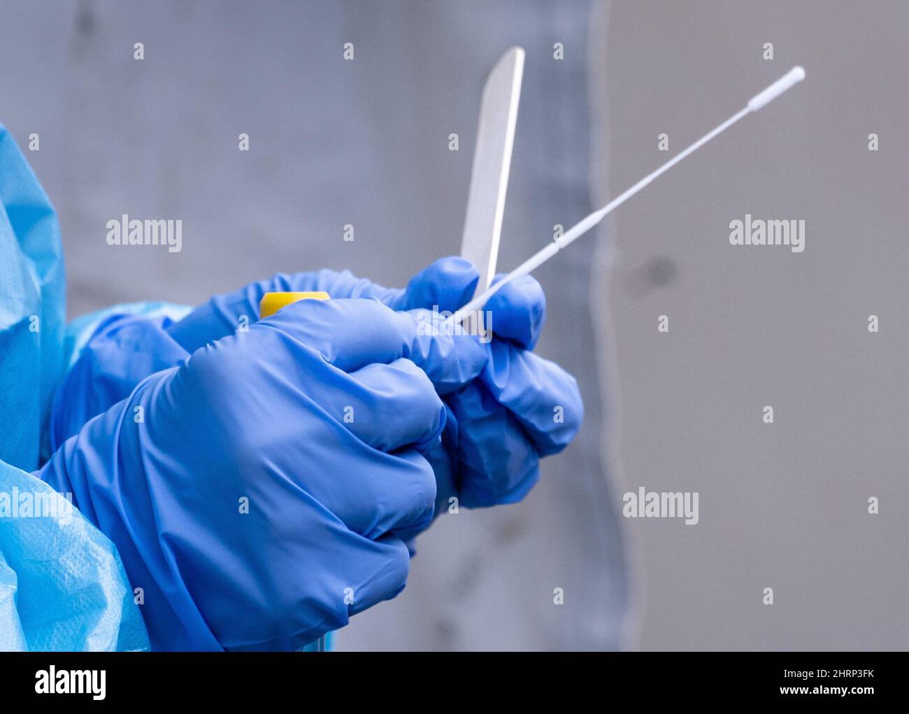 A nurse gets a swab ready at a temporary COVID-19 test clinic in ...