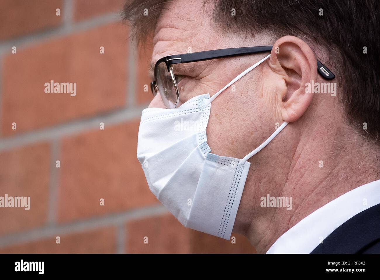 British Columbia Health Minister Adrian Dix wears a face mask to curb ...