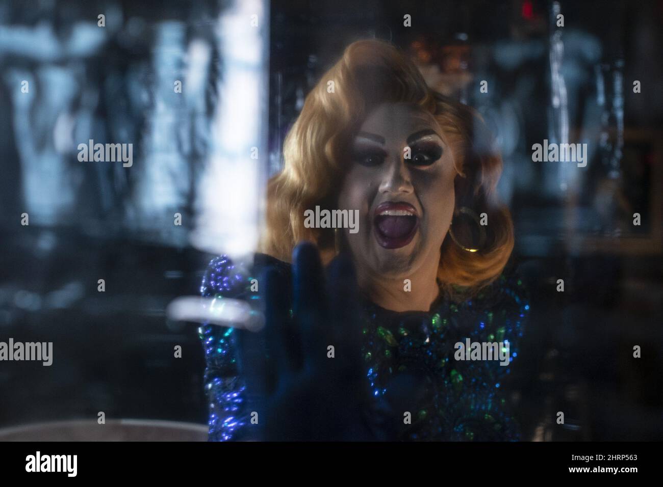 Drag Queen Miss Conception (aka Kevin Levesque) is photographed behind ...