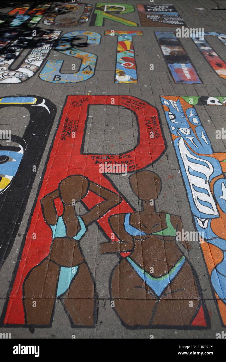 People look at the More Justice More Peace Mural created by 17 artists ...