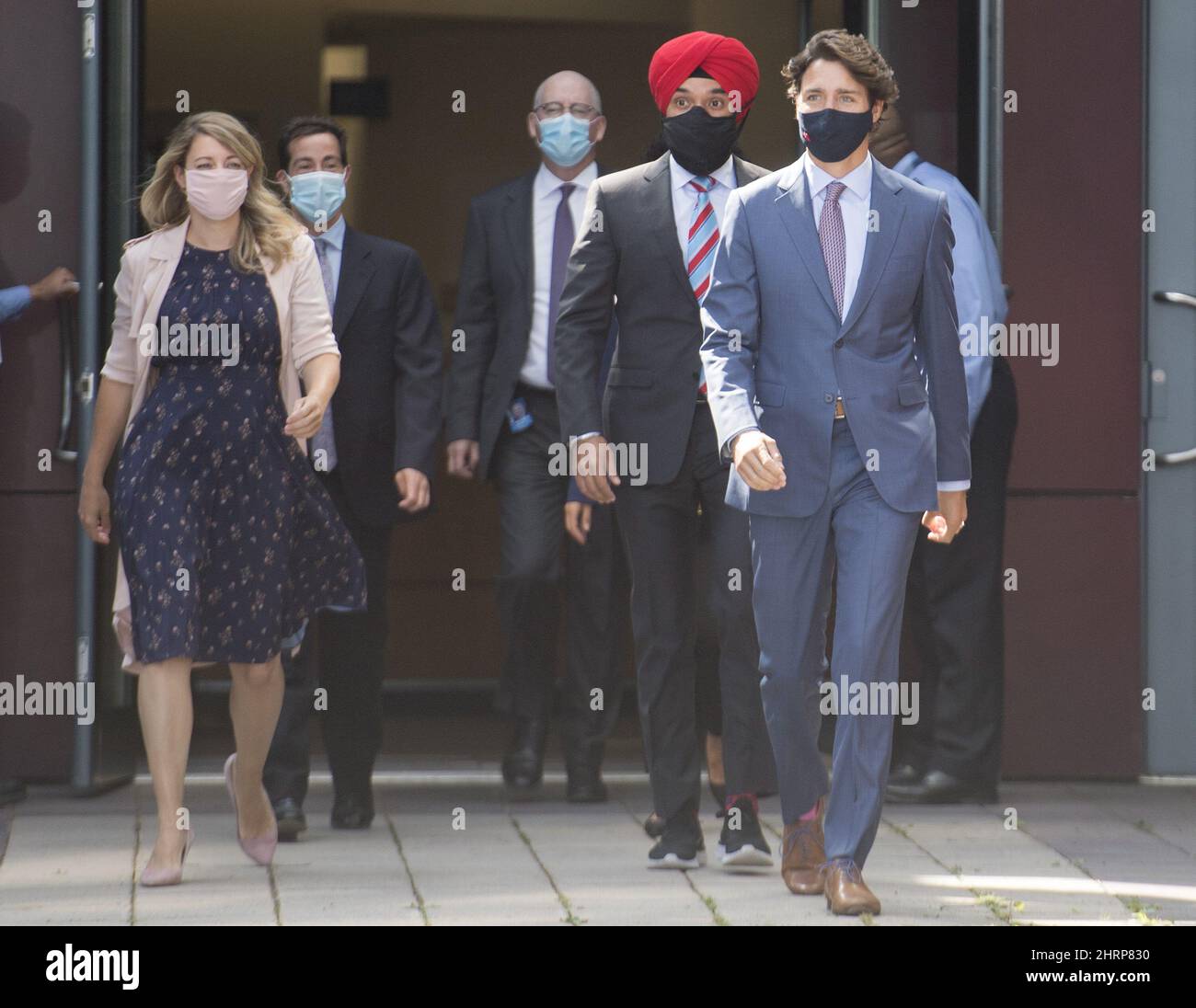 Prime Minister Justin Trudeau, right, alongside Minister for Economic ...