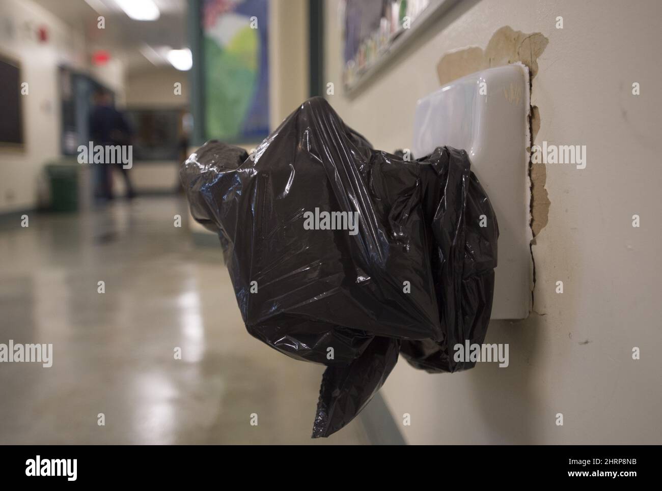 A water fountain is covered in a garbage bag during a media tour of ...
