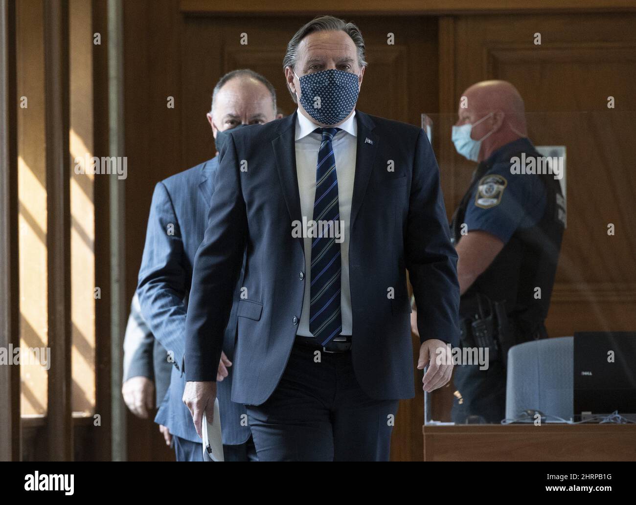 Quebec Premier Francois Legault, followed by Quebec Health Minister ...