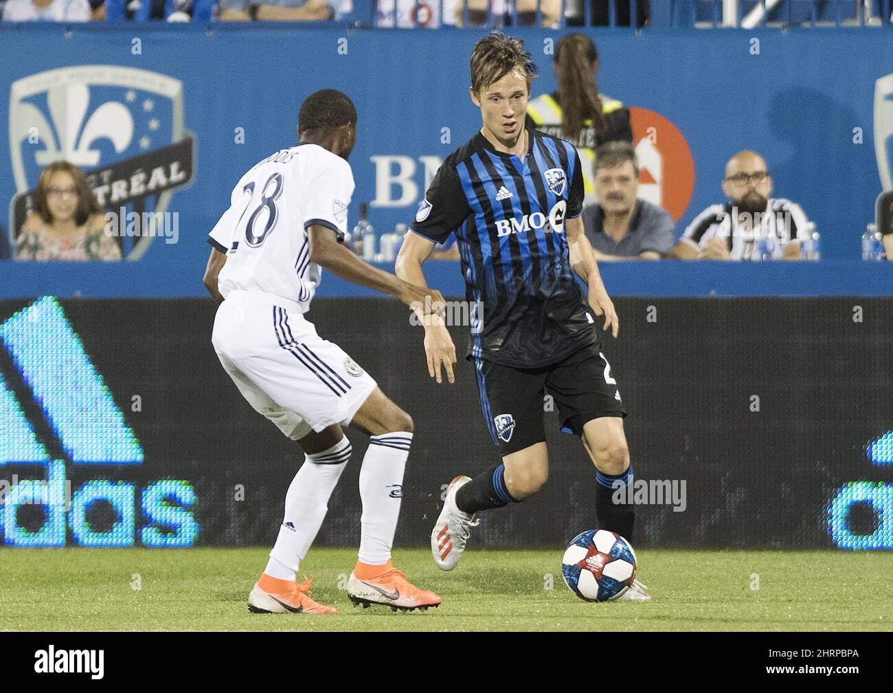 Montreal Impact's Lassi Lappalainen, right, moves in on Philadelphia ...