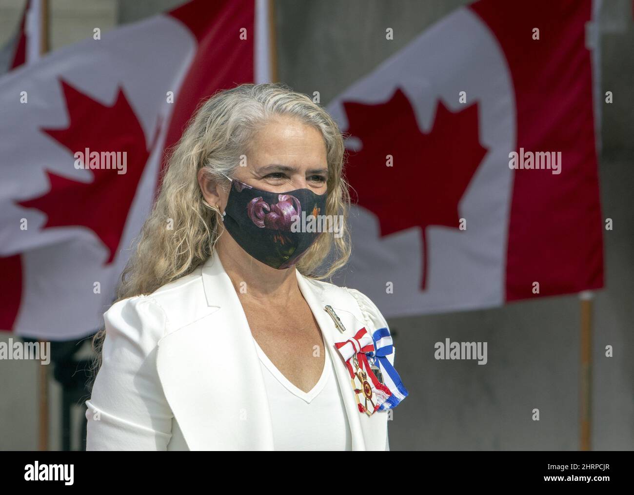 Gov. Gen. Julie Payette takes the royal salute from the Guard of Honour as she makes her way ...
