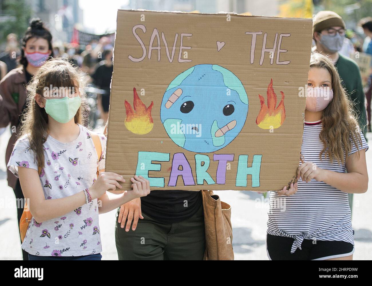 People attend a climate change protest in Montreal, Saturday, September ...