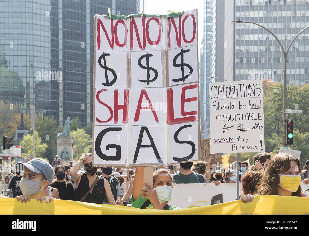 People attend a climate change protest in Montreal, Saturday, September ...