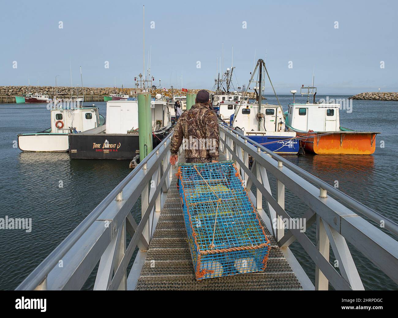 Members of the Sipekne'katik First Nation load lobster traps on the ...