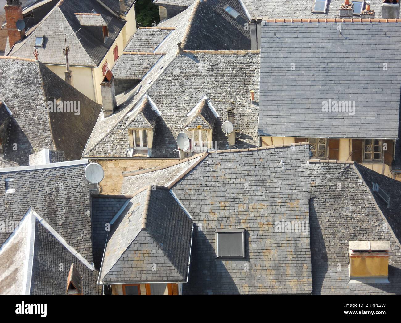 Close view of a set of traditional Lauze (kind of slate) roofs in a ...