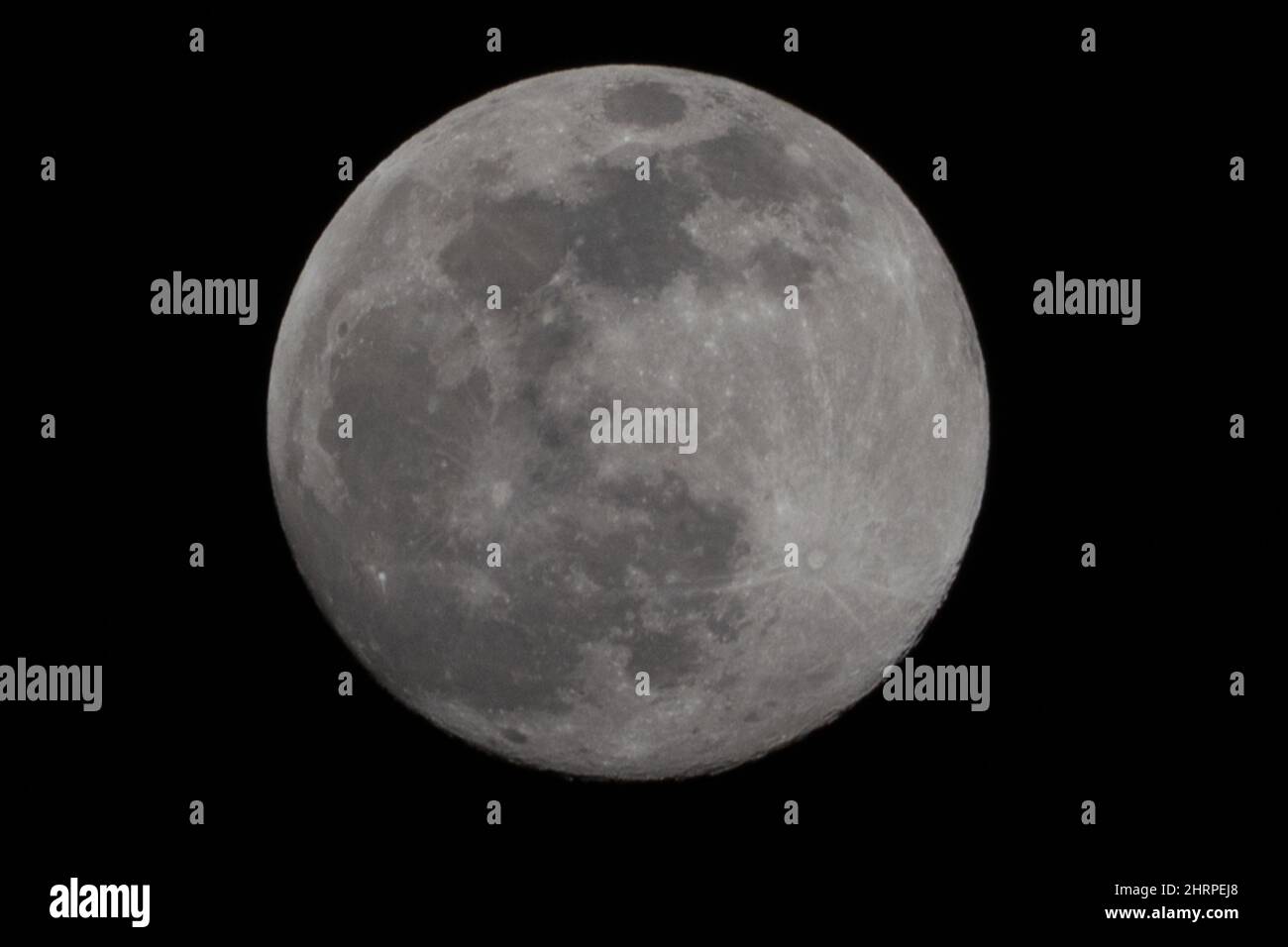 Zoomed view of the beautiful grey Moon with pits on the lunar surface ...