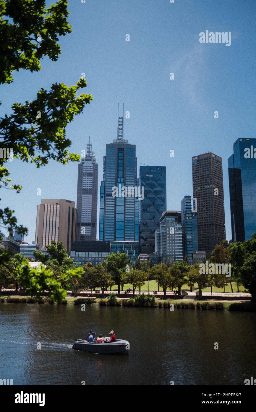 Vertical shot of tall skyscrapers in Melbourne, Australia, and a river ...