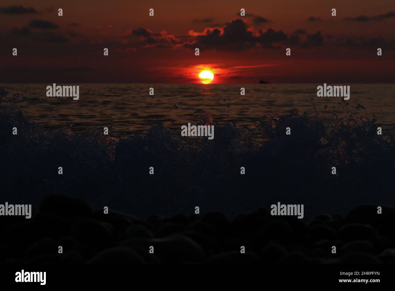Beautiful view of a sunset over the sea Stock Photo - Alamy