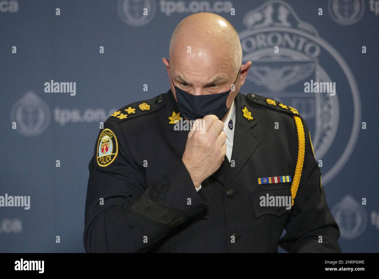 Toronto Police Chief James Ramer adjusts his mask following a news ...