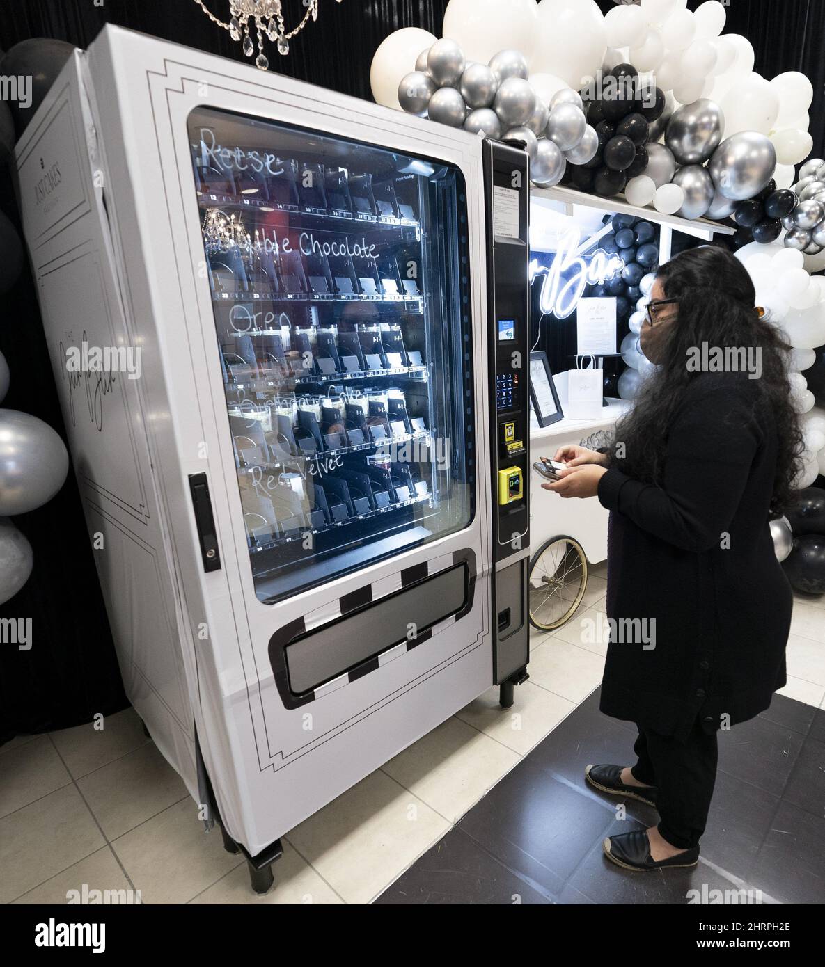 Customer Amrit Douhlani purchases a cake in a jar from the Jar Bar ...