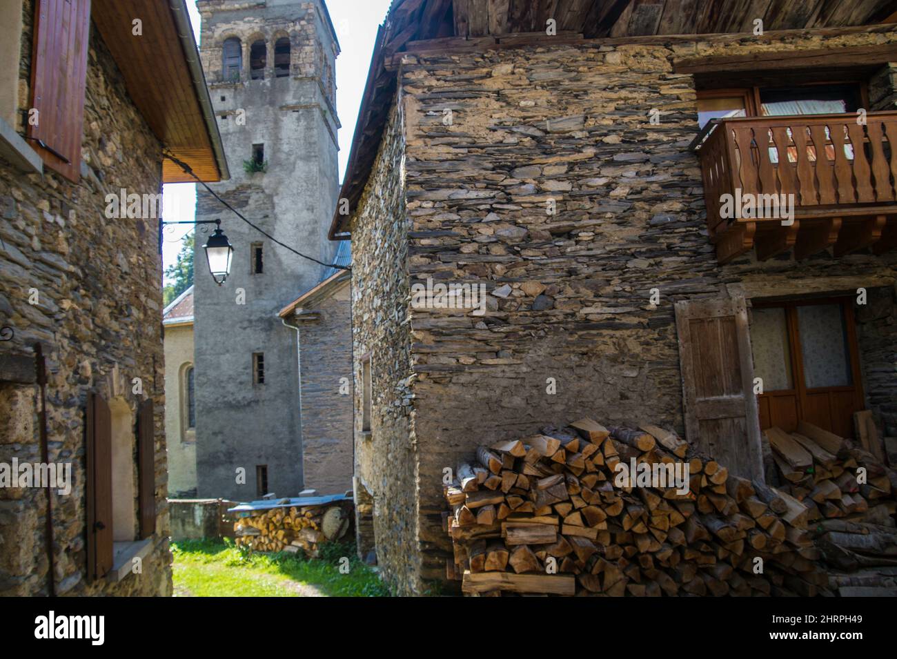 Scenic view of antique stone buildings surrounded by green mountains in ...