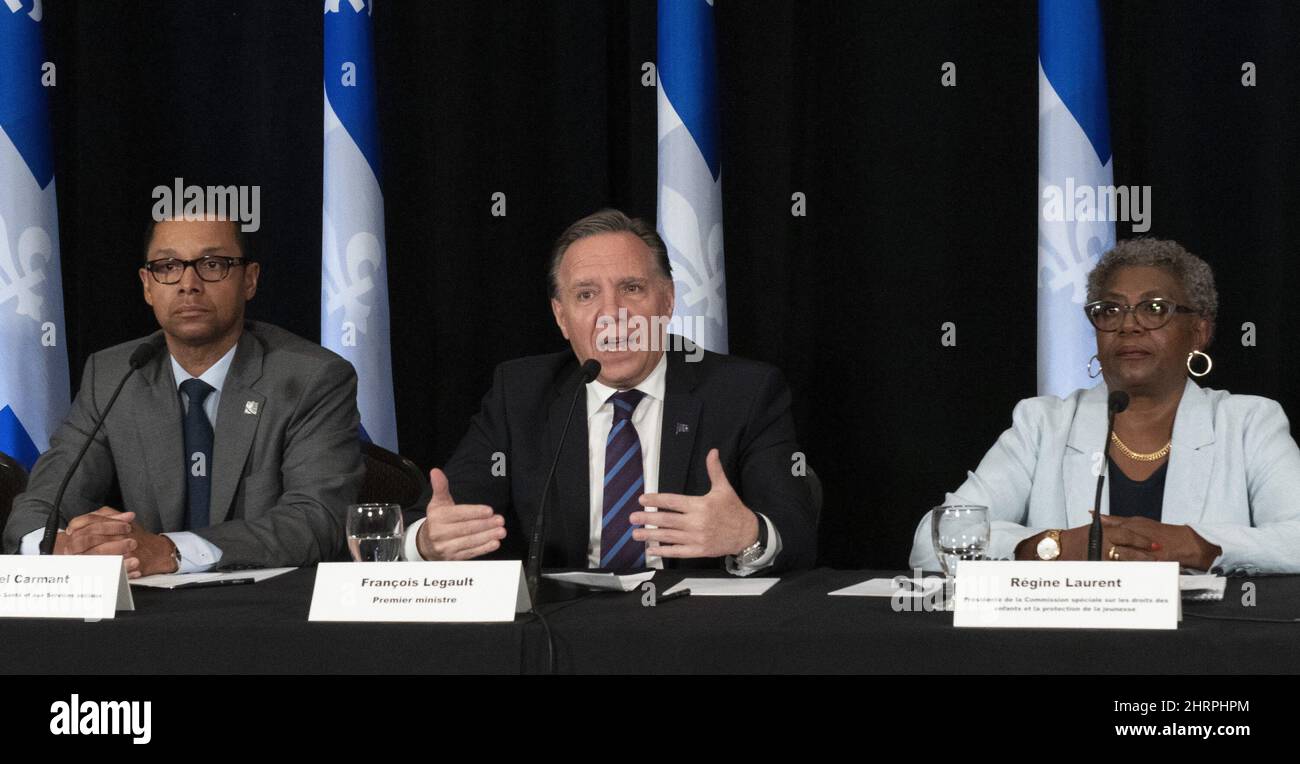 Quebec Premier Francois Legault, centre, announces details of a ...