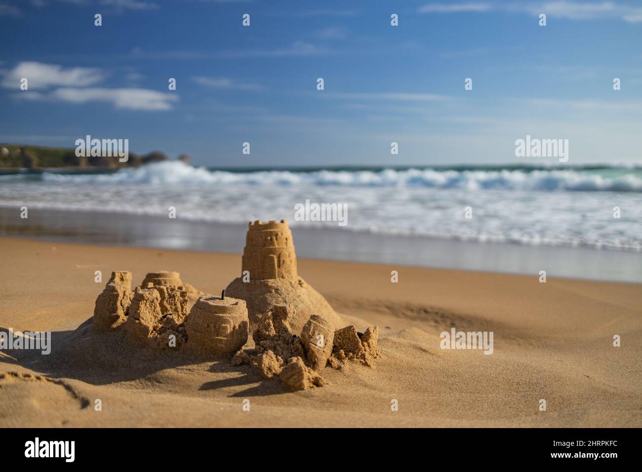 Sandcastle on a sunny beach Stock Photo - Alamy
